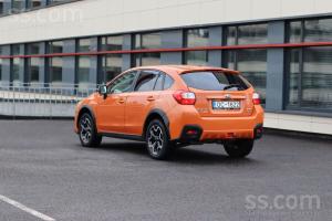 Orange Subaru XV 2012 in Riga, with an engine capacity of 2.00 L and mileage of 213 thousand km for 5980 €, photo 4 on AUTOMOTO.COM.LV