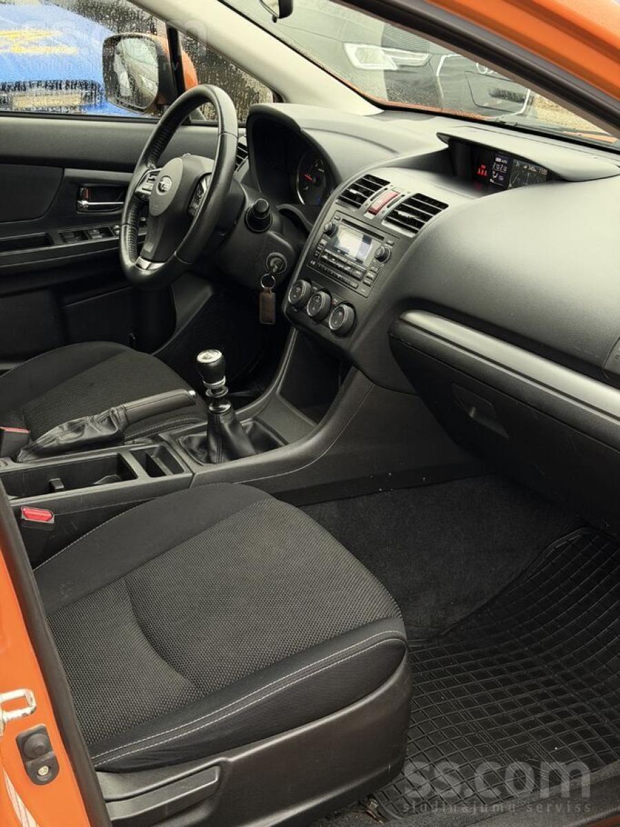 Orange Subaru XV 2012 in Riga, with an engine capacity of 2.00 L and mileage of 213 thousand km for 5980 €, photo 9 on AUTOMOTO.COM.LV