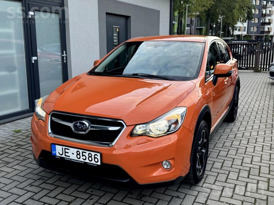 Orange Subaru XV 2013 in Riga, with an engine capacity of 1.60 L and mileage of 157 thousand km for 7700 €, photo 1 on AUTOMOTO.COM.LV