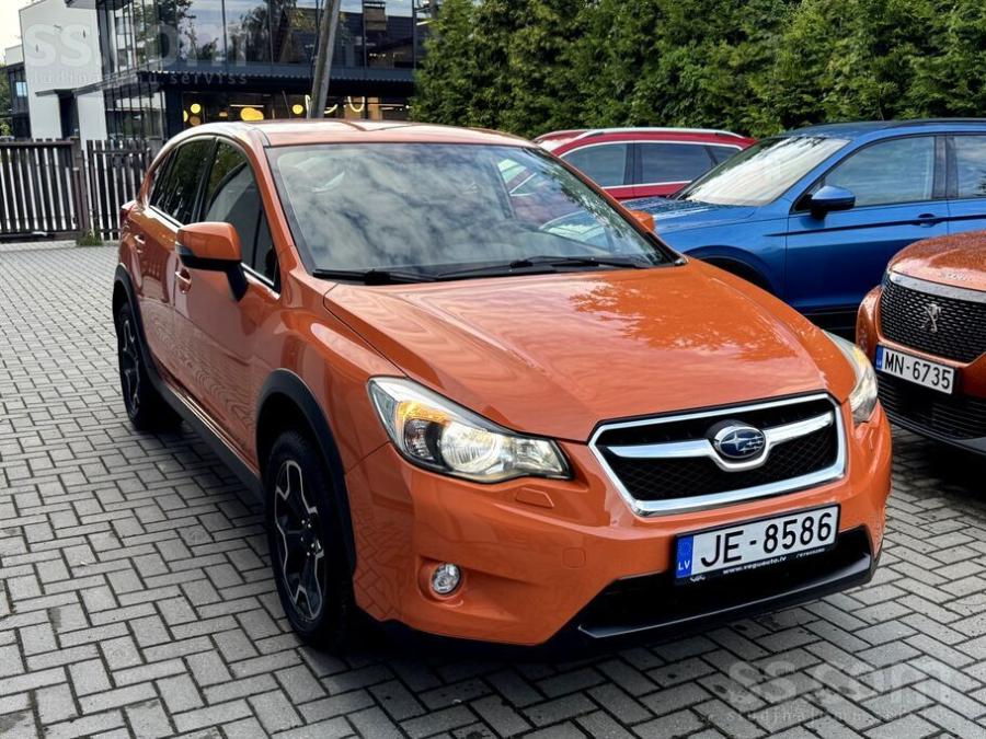 Orange Subaru XV 2013 in Riga, with an engine capacity of 1.60 L and mileage of 157 thousand km for 7700 €, photo 3 on AUTOMOTO.COM.LV