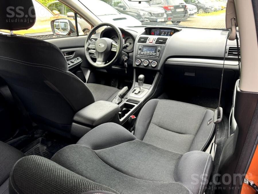 Orange Subaru XV 2013 in Riga, with an engine capacity of 2.00 L and mileage of 167 thousand km for 7700 €, photo 12 on AUTOMOTO.COM.LV