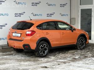 Orange Subaru XV 2012 in Riga, with an engine capacity of 2.00 L and mileage of 163 thousand km for 6500 €, photo 4 on AUTOMOTO.COM.LV