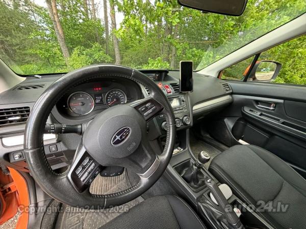 Orange Subaru XV 2012 in Tallinn, with an engine capacity of 2.00 L and mileage of 230 thousand km for 5800 €, photo 9 on AUTOMOTO.COM.LV