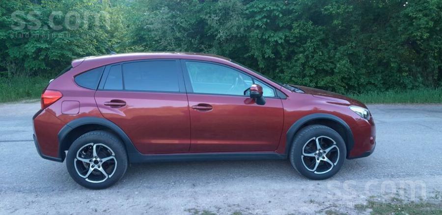 Red Subaru XV 2014 in Riga, with an engine capacity of 2.00 L and mileage of 142 thousand km for 6800 €, photo 5 on AUTOMOTO.COM.LV