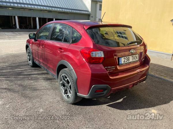 Red Subaru XV 2013 in Tallinn, with an engine capacity of 2.00 L and mileage of 105 thousand km for 8999 €, photo 4 on AUTOMOTO.COM.LV