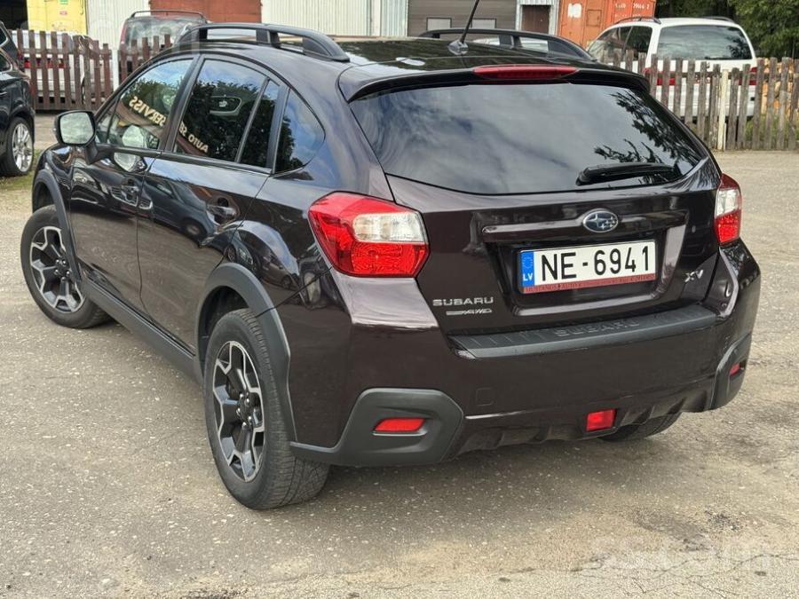 Violet Subaru XV 2012 in Riga, with an engine capacity of 2.00 L and mileage of 218 thousand km for 7950 €, photo 4 on AUTOMOTO.COM.LV
