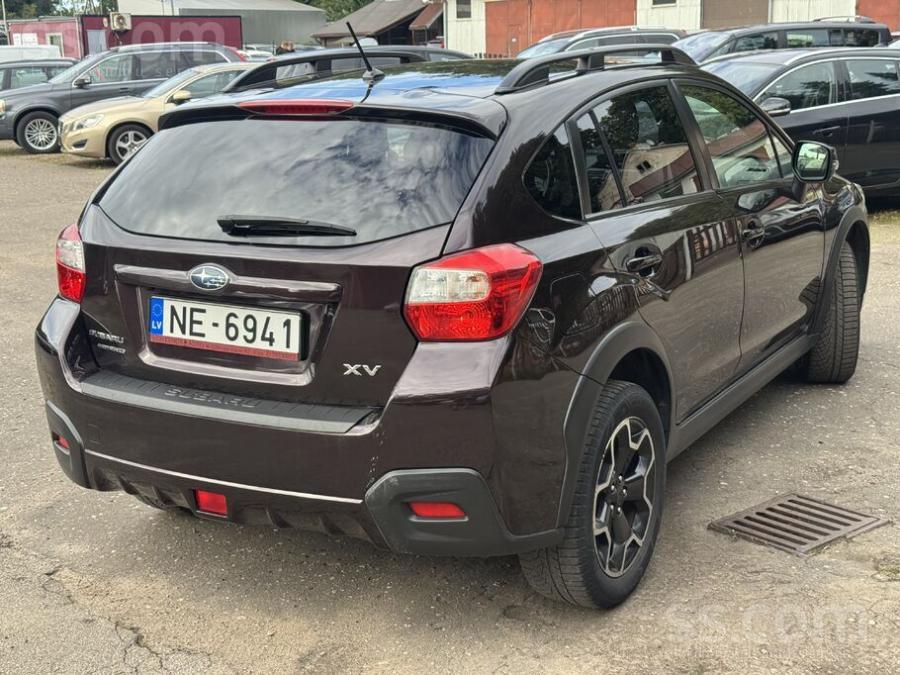 Violet Subaru XV 2012 in Riga, with an engine capacity of 2.00 L and mileage of 218 thousand km for 7950 €, photo 6 on AUTOMOTO.COM.LV