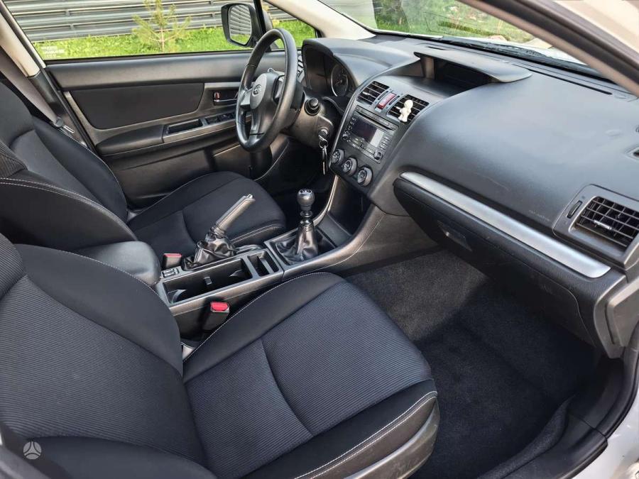 White Subaru XV 2014 in Vilnius, with an engine capacity of 2.00 L and mileage of 189 thousand km for 6850 €, photo 8 on AUTOMOTO.COM.LV