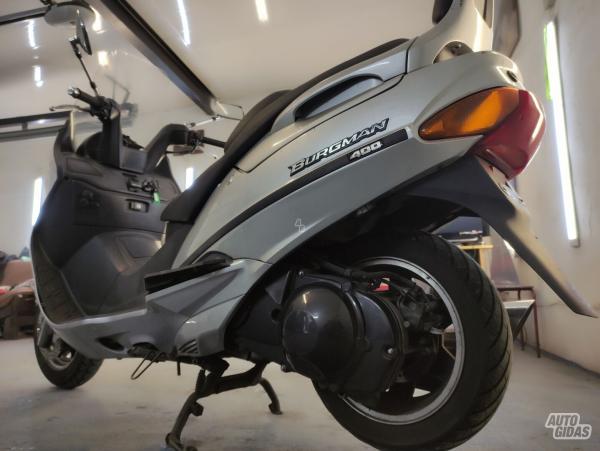 Suzuki Burgman 1999 Utena, ar dzinēja tilpumu 0.00 L un nobraukumu 49 tūkst. km par 1100 €, foto 3 vietnē AUTOMOTO.COM.LV