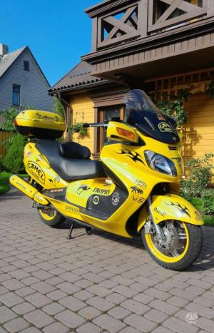 Yellow Suzuki Burgman 2003 in Kelme, with an engine capacity of 0.65 L and mileage of 57 thousand km for 2300 €, photo  on AUTOMOTO.COM.LV