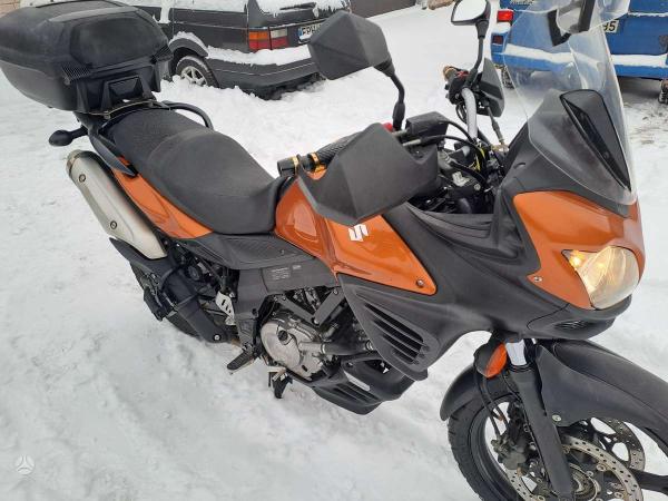 Orange Suzuki DL 2012 in Panevezys, with an engine capacity of 0.65 L and mileage of 29 thousand km for 3900 €, photo 7 on AUTOMOTO.COM.LV