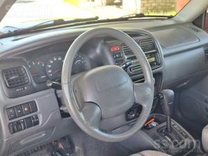 Red Suzuki grand-vitara 2000 in Ventspils, with an engine capacity of 2.00 L and mileage of 289 thousand km for 1590 €, photo 6 on AUTOMOTO.COM.LV