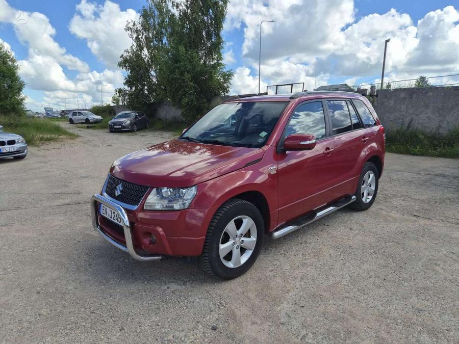 Red Suzuki grand-vitara 2012 in Utena, with an engine capacity of 1.87 L and mileage of 248 thousand km for 5650 €, photo 1 on AUTOMOTO.COM.LV