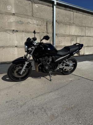 Black Suzuki GSF 2005 in Kaunas, with an engine capacity of 0.66 L and mileage of 61 thousand km for 1650 €, photo 4 on AUTOMOTO.COM.LV