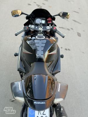 Melns Suzuki GSX-R 2006 Utena, ar dzinēja tilpumu 1.00 L un nobraukumu 72 tūkst. km par 4700 €, foto 13 vietnē AUTOMOTO.COM.LV