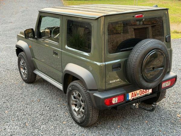 Green Suzuki Jimny 2023 in Kaunas, with an engine capacity of 1.50 L and mileage of 37 thousand km for 32546 €, photo 6 on AUTOMOTO.COM.LV