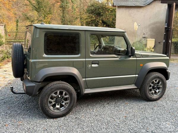 Green Suzuki Jimny 2023 in Kaunas, with an engine capacity of 1.50 L and mileage of 37 thousand km for 32546 €, photo 9 on AUTOMOTO.COM.LV