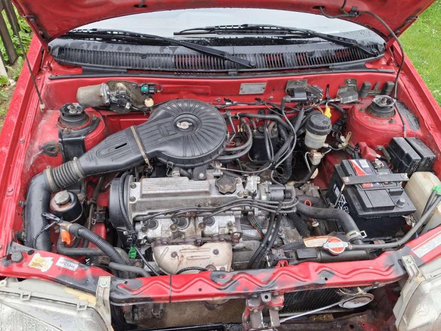 Red Suzuki Swift 2002 in Vilnius, with an engine capacity of 1.00 L and mileage of 97 thousand km for 750 €, photo 6 on AUTOMOTO.COM.LV