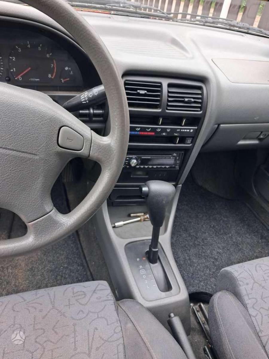 Red Suzuki Swift 2002 in Vilnius, with an engine capacity of 1.00 L and mileage of 97 thousand km for 750 €, photo 9 on AUTOMOTO.COM.LV
