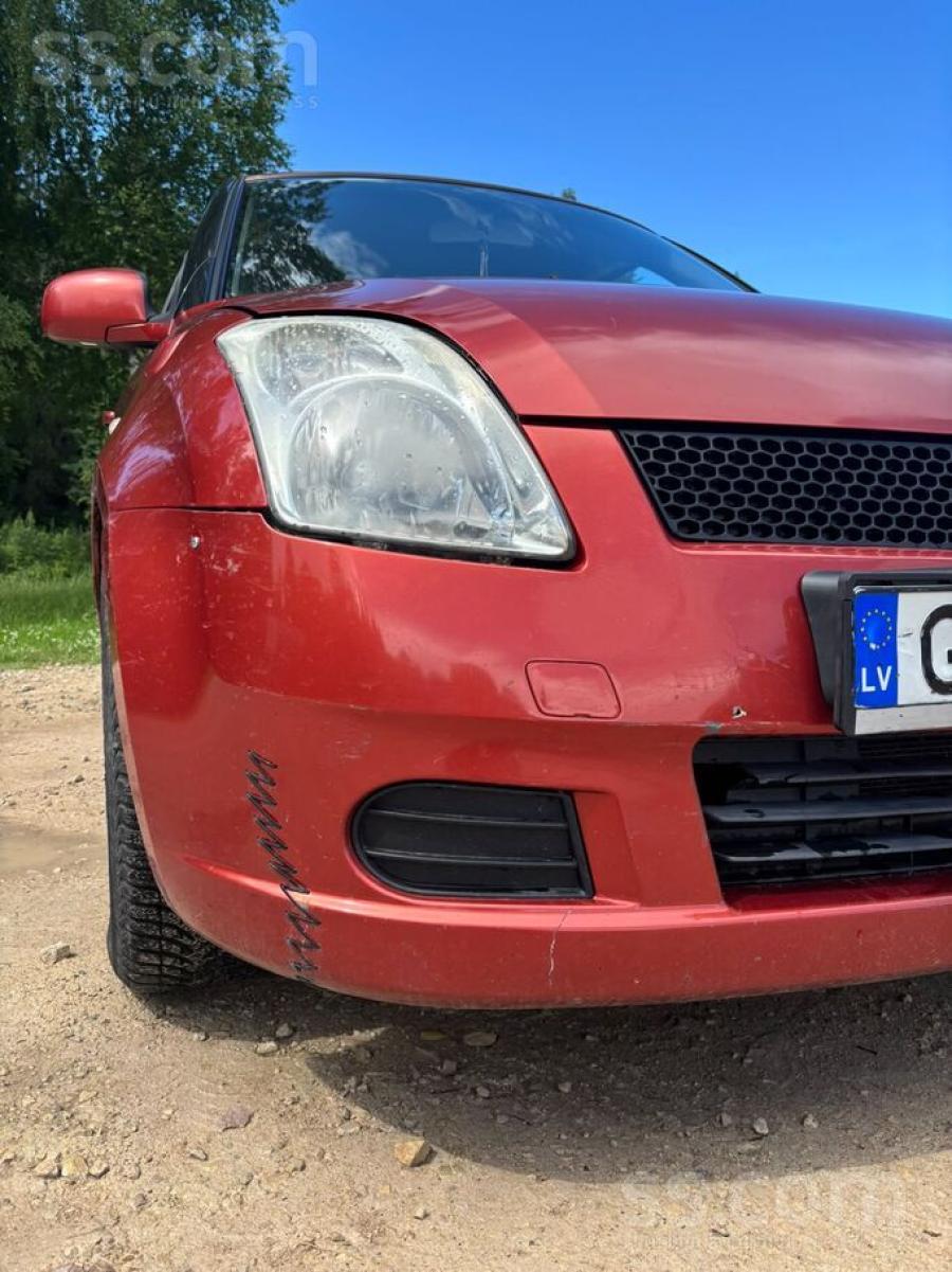 Red Suzuki Swift 2007 in Aluksne, with an engine capacity of 1.30 L and mileage of 184 thousand km for 1150 €, photo 7 on AUTOMOTO.COM.LV