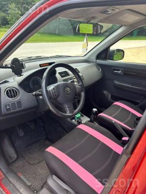 Red Suzuki Swift 2007 in Aluksne, with an engine capacity of 1.30 L and mileage of 184 thousand km for 1150 €, photo 8 on AUTOMOTO.COM.LV