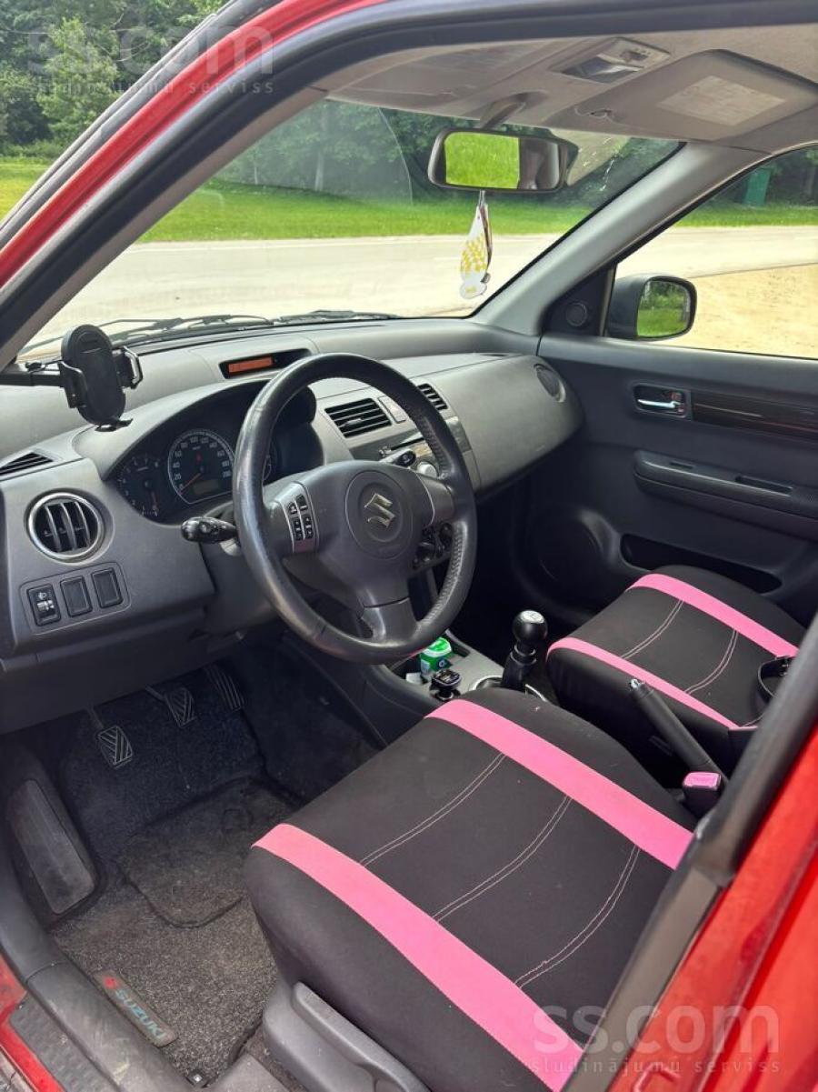 Red Suzuki Swift 2007 in Aluksne, with an engine capacity of 1.30 L and mileage of 184 thousand km for 1150 €, photo 8 on AUTOMOTO.COM.LV