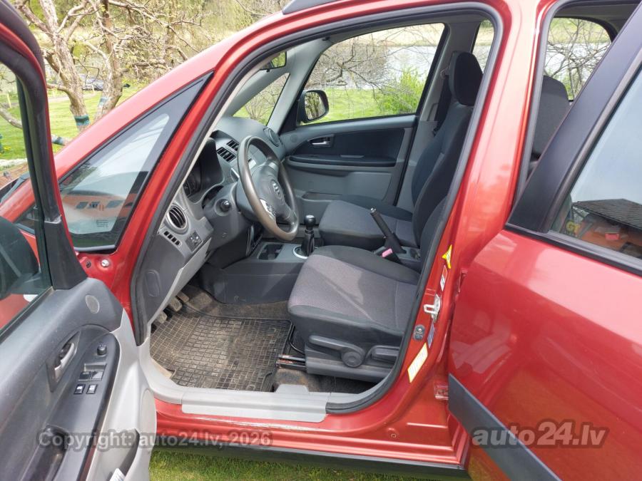 Orange Suzuki SX4 2007 in Tartu, with an engine capacity of 1.60 L and mileage of 164 thousand km for 3100 €, photo 8 on AUTOMOTO.COM.LV