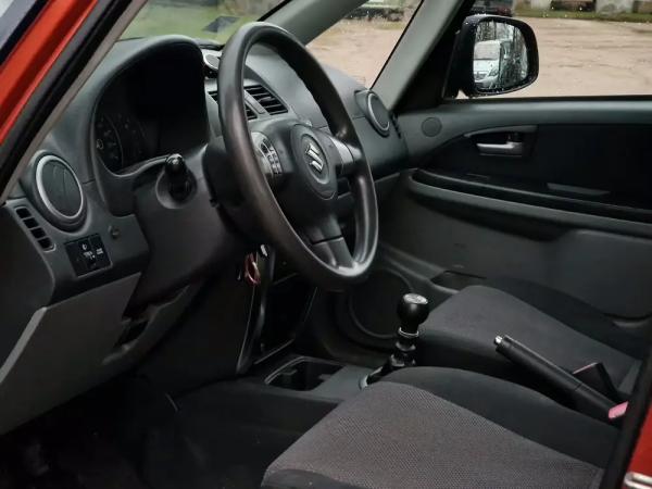 Orange Suzuki SX4 2009 in Grobiņa, with an engine capacity of 1.90 L and mileage of 341 thousand km for 2450 €, photo 9 on AUTOMOTO.COM.LV
