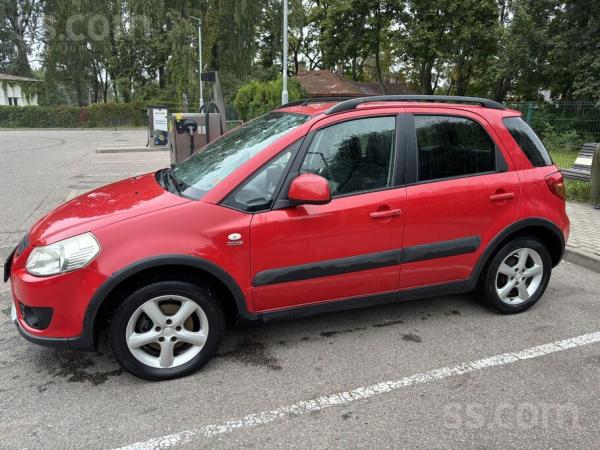 Red Suzuki SX4 2009 in Riga, with an engine capacity of 1.90 L and mileage of 215 thousand km for 4250 €, photo 1 on AUTOMOTO.COM.LV