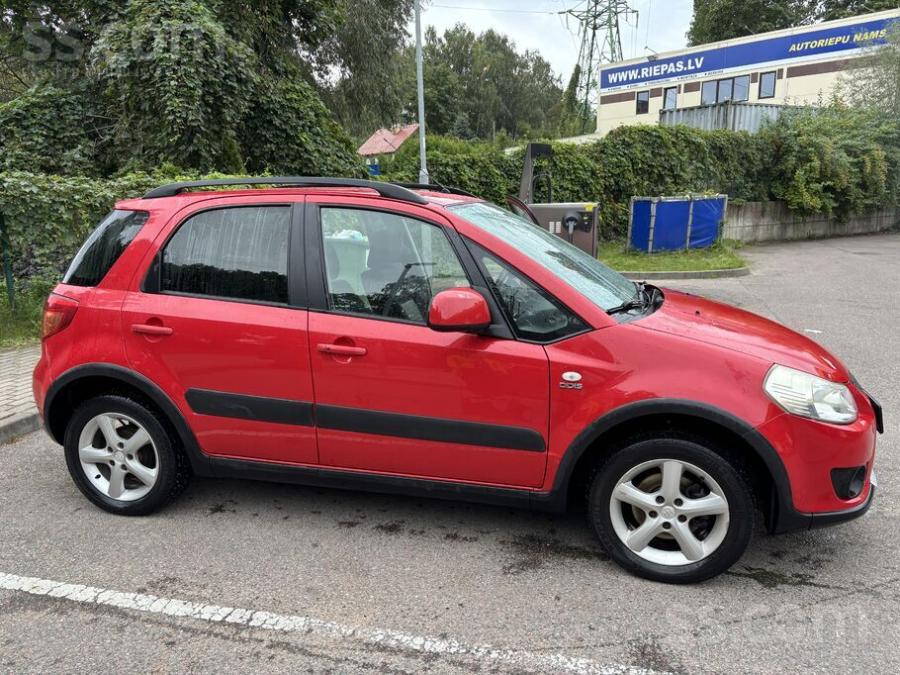 Sarkans Suzuki SX4 2009 Rīga, ar dzinēja tilpumu 1.90 L un nobraukumu 215 tūkst. km par 4250 €, foto 4 vietnē AUTOMOTO.COM.LV