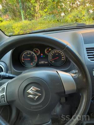 Violet Suzuki SX4 2013 in Riga, with an engine capacity of 1.60 L and mileage of 260 thousand km for 4350 €, photo 6 on AUTOMOTO.COM.LV