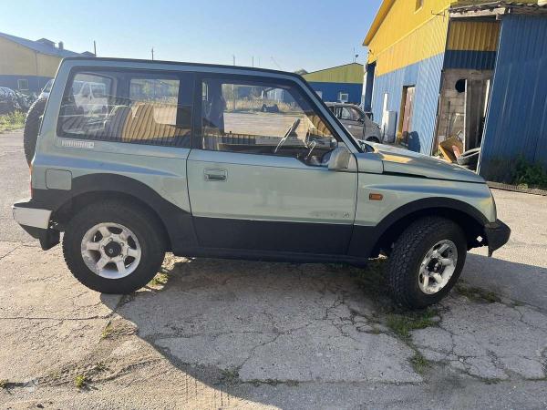 Green Suzuki Vitara 1991 in Taurage, with an engine capacity of 1.59 L and mileage of 235 thousand km for 1999 €, photo 1 on AUTOMOTO.COM.LV
