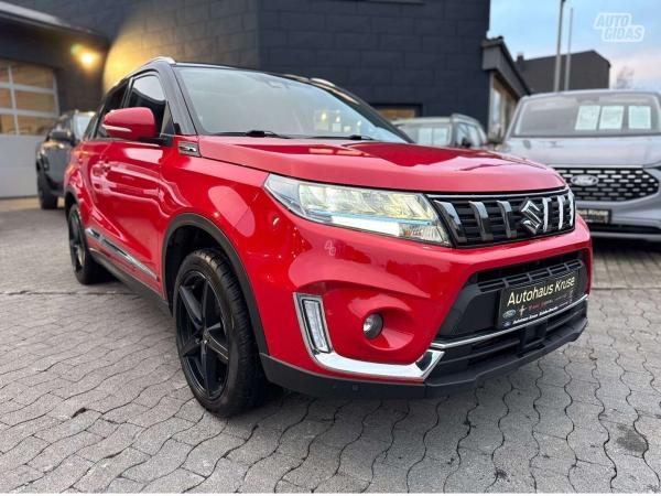Red Suzuki Vitara 2023 in Kaunas, with an engine capacity of 1.40 L and mileage of 27 thousand km for 23420 €, photo 1 on AUTOMOTO.COM.LV