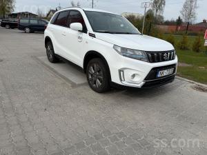 White Suzuki Vitara 2023 in Riga, with an engine capacity of 1.50 L and mileage of 85 thousand km for 21900 €, photo  on AUTOMOTO.COM.LV