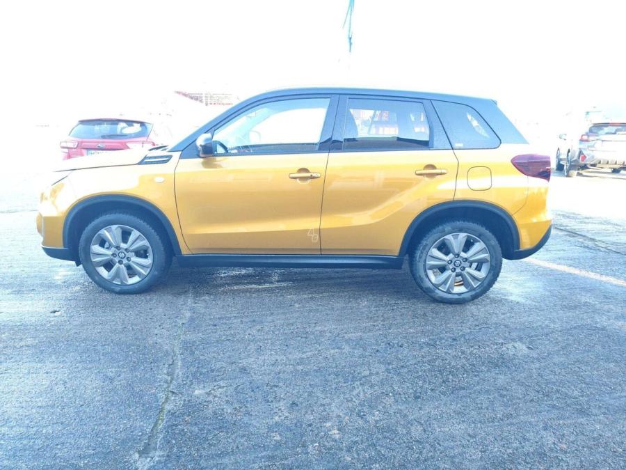 Yellow Suzuki Vitara 2023 in Kaunas, with an engine capacity of 1.50 L and mileage of 20 thousand km for 25274 €, photo 1 on AUTOMOTO.COM.LV