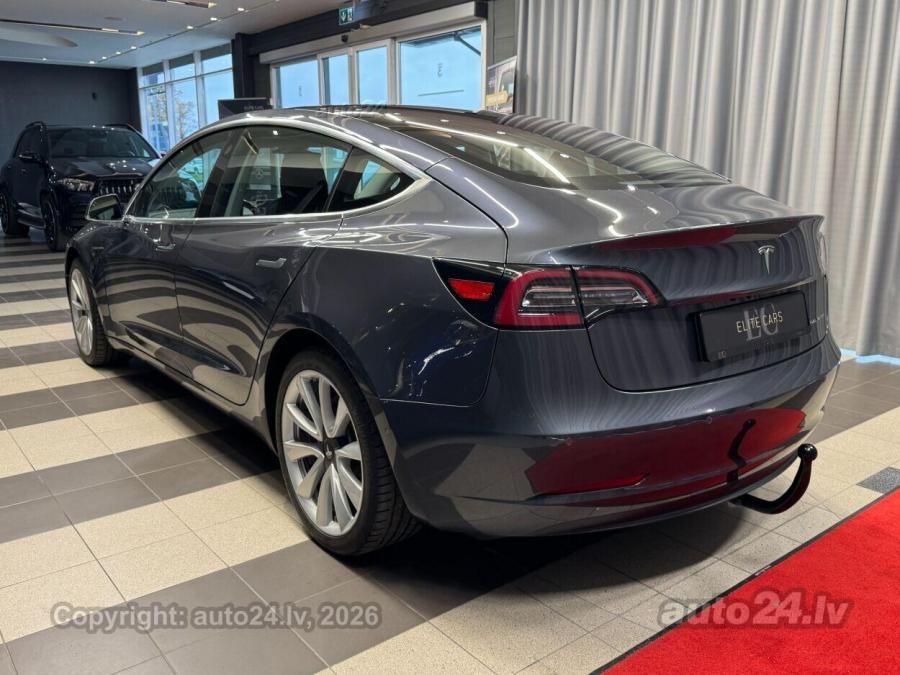 Black Tesla Model 3 2019 in Riga, with an engine capacity of 0.00 L and mileage of 145 thousand km for 19490 €, photo 7 on AUTOMOTO.COM.LV