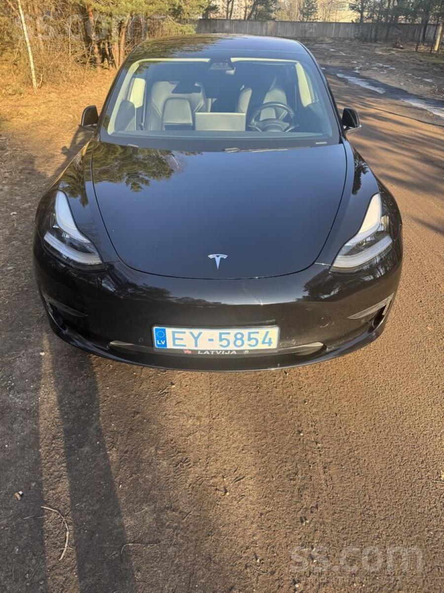 Black Tesla Model 3 2019 in Riga, with an engine capacity of 0.00 L and mileage of 94 thousand km for 19000 €, photo 1 on AUTOMOTO.COM.LV