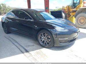 Black Tesla Model 3 2019 in Klaipeda, with an engine capacity of 0.00 L and mileage of 68 thousand km for 9500 €, photo 3 on AUTOMOTO.COM.LV