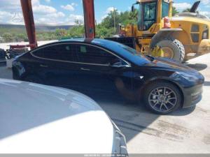 Black Tesla Model 3 2019 in Klaipeda, with an engine capacity of 0.00 L and mileage of 68 thousand km for 9500 €, photo 10 on AUTOMOTO.COM.LV
