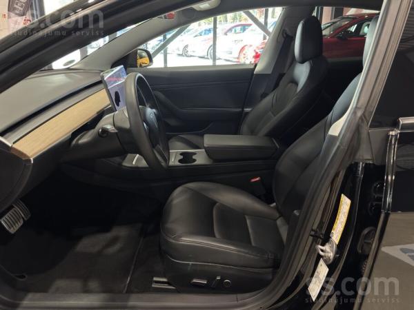Black Tesla Model 3 2020 in Riga, with an engine capacity of 0.00 L and mileage of 69 thousand km for 28990 €, photo 8 on AUTOMOTO.COM.LV