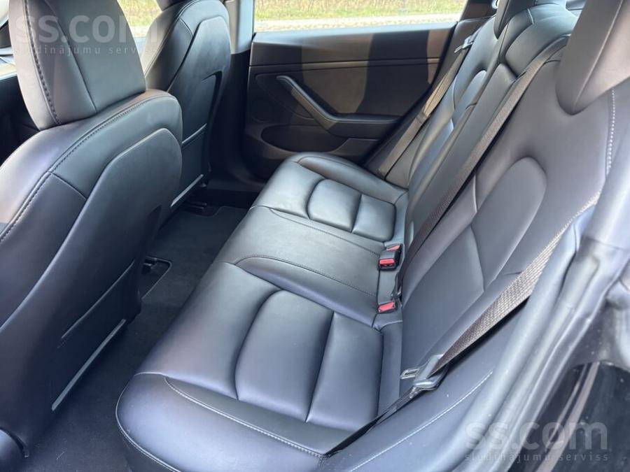 Black Tesla Model 3 2021 in Riga, with an engine capacity of 0.00 L and mileage of 110 thousand km for 25900 €, photo 14 on AUTOMOTO.COM.LV