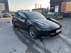 Black Tesla Model 3 2021 in Vilnius, with an engine capacity of 0.00 L and mileage of 86 thousand km for 18500 €, photo 2 on AUTOMOTO.COM.LV