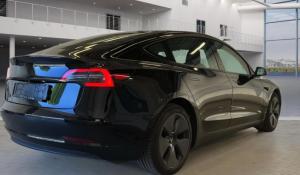 Black Tesla Model 3 2021 in Riga, with an engine capacity of 0.00 L and mileage of 98 thousand km for 24490 €, photo 3 on AUTOMOTO.COM.LV
