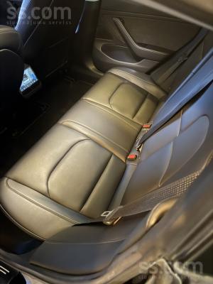 Black Tesla Model 3 2021 in Riga, with an engine capacity of 0.00 L and mileage of 119 thousand km for 24000 €, photo 8 on AUTOMOTO.COM.LV