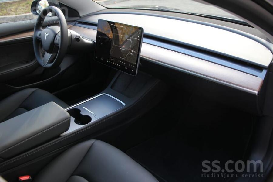 Black Tesla Model 3 2022 in Riga, with an engine capacity of 0.00 L and mileage of 39 thousand km for 34500 €, photo 5 on AUTOMOTO.COM.LV
