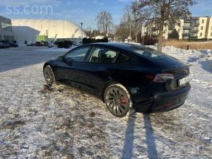 Black Tesla Model 3 2023 in Riga, with an engine capacity of 0.00 L and mileage of 58 thousand km for 35000 €, photo 3 on AUTOMOTO.COM.LV