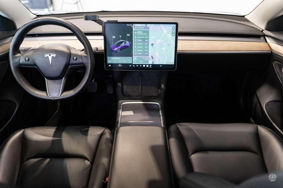 Blue Tesla Model 3 2021 in Vilnius, with an engine capacity of 0.00 L and mileage of 63 thousand km for 22500 €, photo 16 on AUTOMOTO.COM.LV