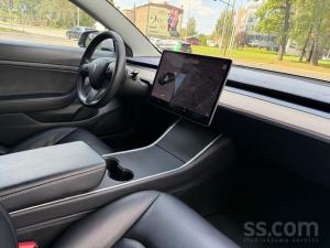 Blue Tesla Model 3 2020 in Riga, with an engine capacity of 0.00 L and mileage of 97 thousand km for 25500 €, photo 6 on AUTOMOTO.COM.LV