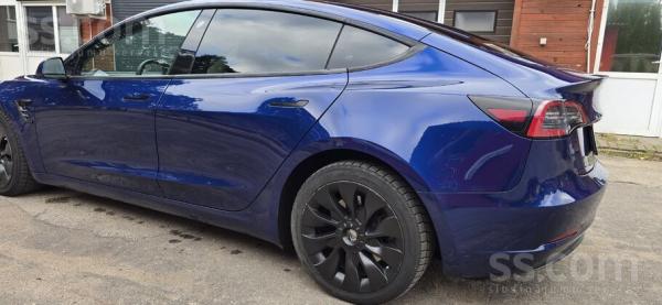 Blue Tesla Model 3 2021 in Riga, with an engine capacity of 0.00 L and mileage of 125 thousand km for 24900 €, photo 5 on AUTOMOTO.COM.LV