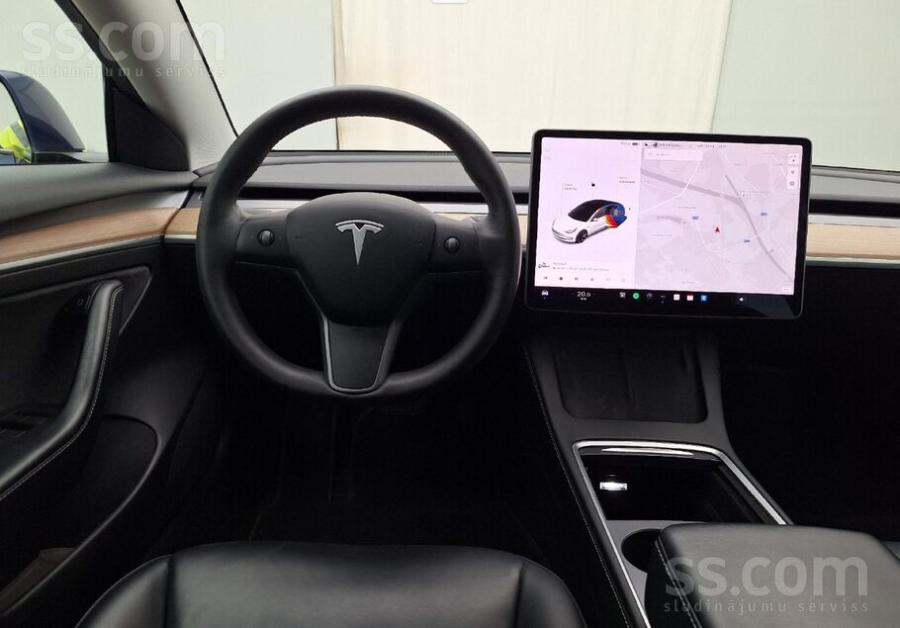 Blue Tesla Model 3 2021 in Riga, with an engine capacity of 0.00 L and mileage of 124 thousand km for 26990 €, photo 6 on AUTOMOTO.COM.LV